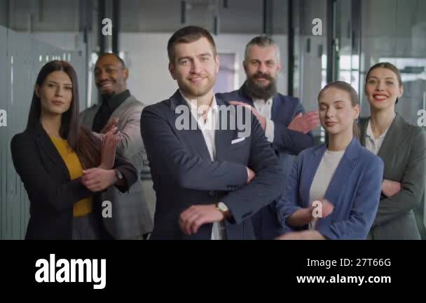 Professional business team in formal attire posing confidently in a ...