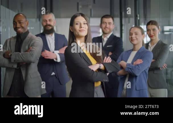 Confident business team posing together in modern office environment, showcasing leadership ...