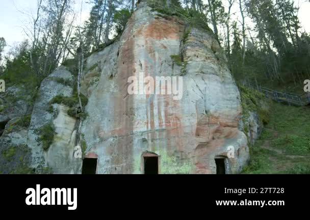 Cliffs with Man-Made Caves on the Riverbank. A Cave or Cavern is a ...