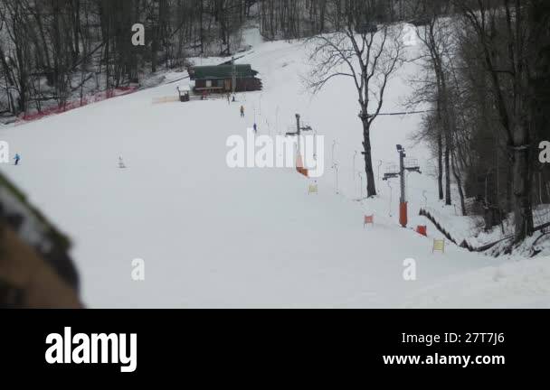 Very Simple Ski Hill in the Forest with a Working Lift. Few People ...