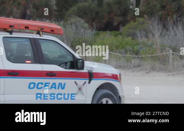 Miami 12.25.2025. lifeguard truck driving at Miami Beach is a powerful ...