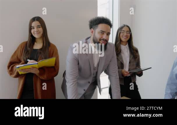 Diverse group of professionals is collaborating in a joyful, productive ...