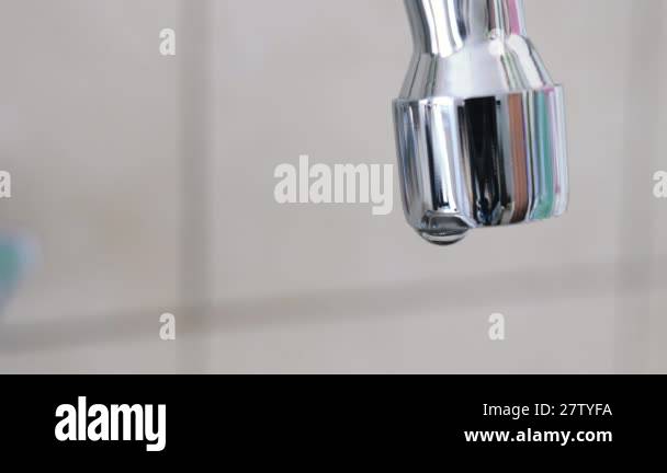 Dripping water from the faucet, waste of water Stock Video Footage - Alamy