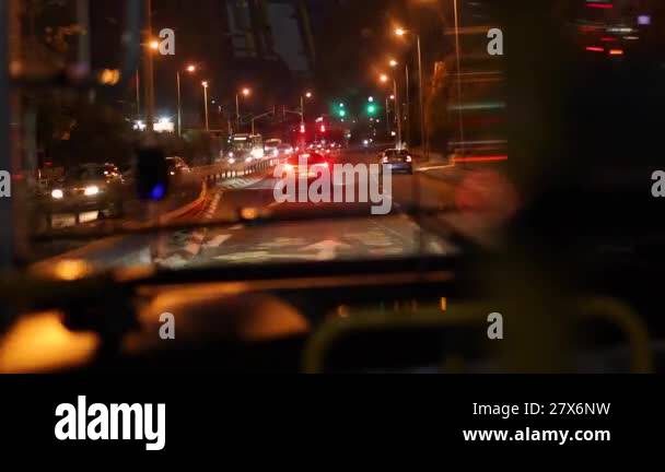 night road in the city. view from the bus window of the night city and road. public transport ...