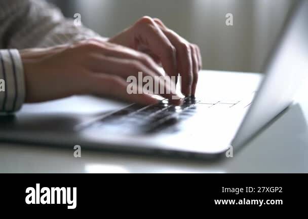Close-up of female hands typing on keyboard using laptop. Student ...