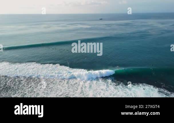 Perfect barrel waves with surfers. Drone view of surfing. Swell wave in ...