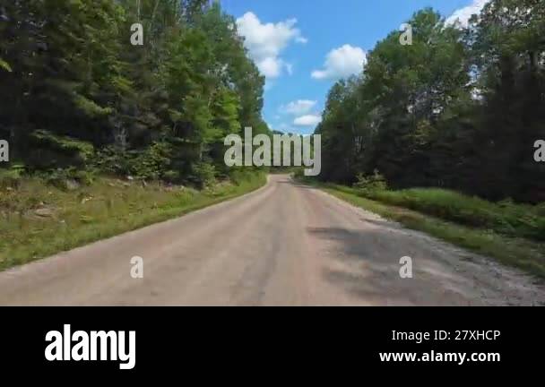 Motocross racer driving plate POV, rides on bumpy offroad, fast driving ...