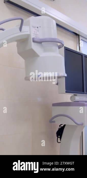 C-Arm fluoroscopy machine standing in the modern surgery room ...