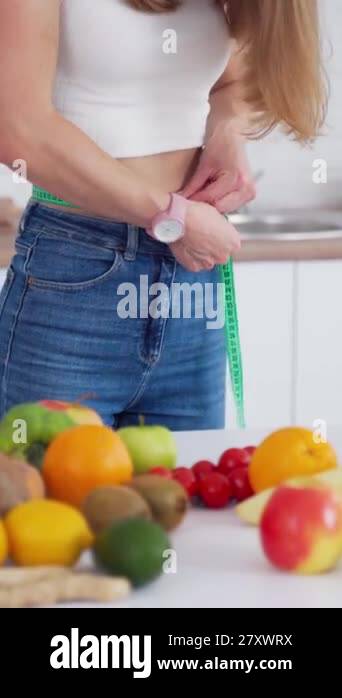 Dieting Concept Young Woman Measures Her Belly In The Kitchen Organic