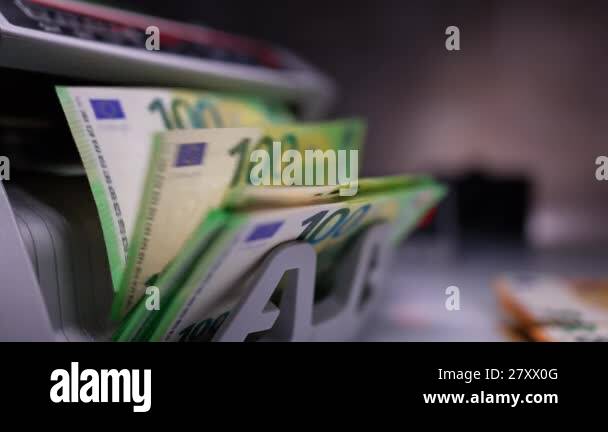 New green banknotes of one hundred euro appear from cash counting ...