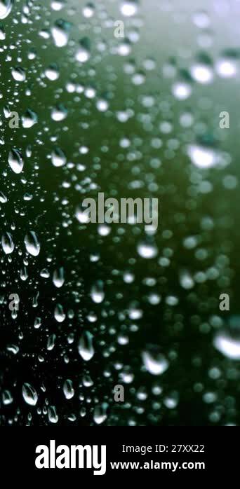 rain days, heavy rain falling on window surface Vertical video Stock ...