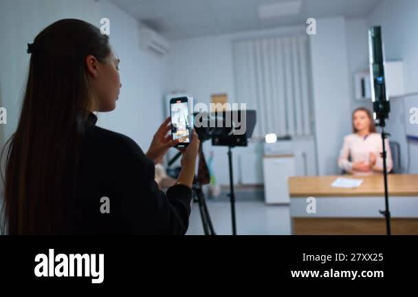 Woman recording video holding Stock Videos & Footage - HD and 4K Video ...