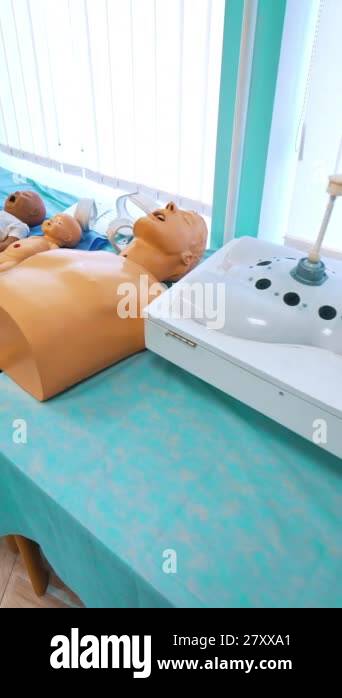 Mannequins on the table for medical training. Plastic dolls and parts ...