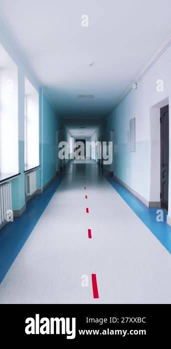 Modern hallway in educational center. Long corridor in blue color with ...
