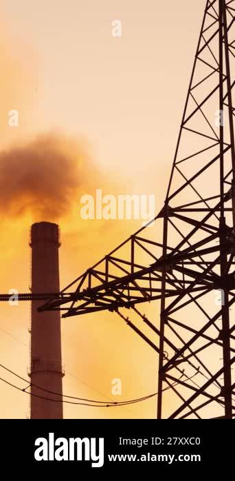 Orange fumes from factory pipes. Dirty clouds of emissions from thick ...