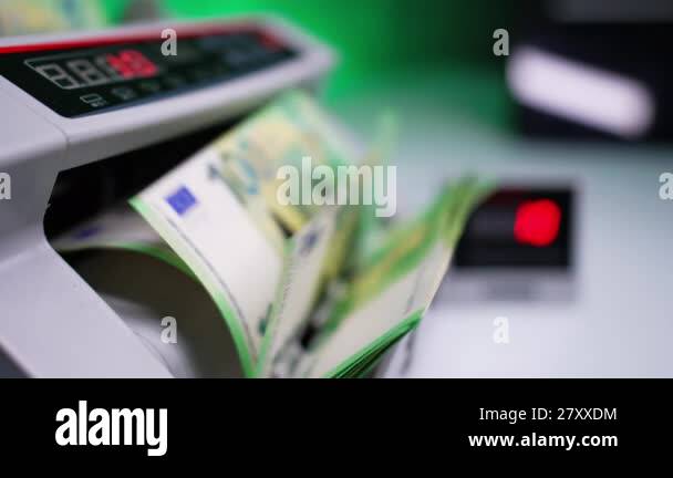 Euro banknotes rotated and counted in cash counting machine. Number run ...