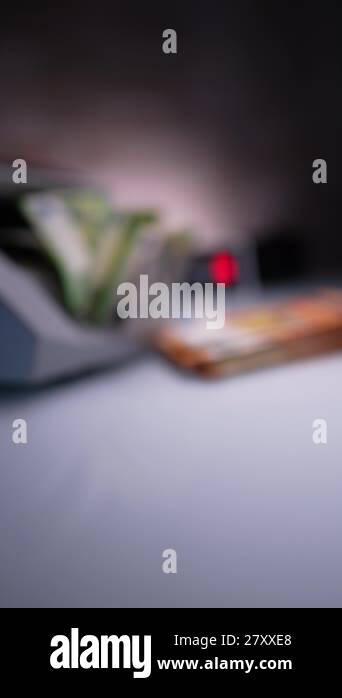 Money counting device works processing cash. Green one hundred euro ...