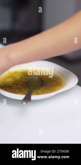 Healthy kid eating at home. Little boy watching tablet while eating on ...