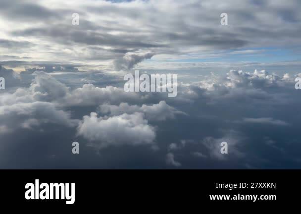 Layers of cumulus clouds, side view from an airplane window Stock Video Footage - Alamy