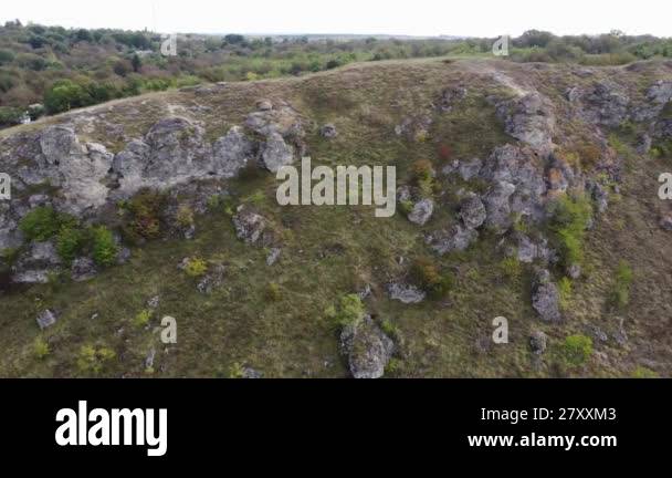 Limestone rock outcrops on steep river bank, aerial view Stock Video ...