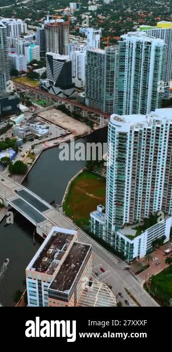 Flying above the diverse cityscape of Miami, Florida, USA. Drone ...