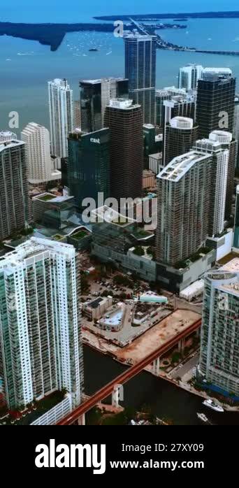 Flight above the magnificent skyscrapers on the shore of Atlantic Ocean ...