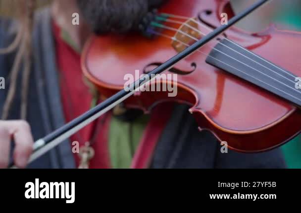 A man is playing a violin. Concept of passion and dedication to music ...