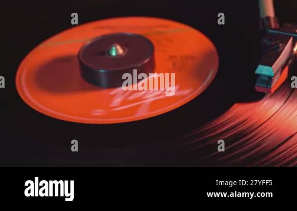 Milan, Italy 1 January 2025: Montage of a vinyl record being played by ...