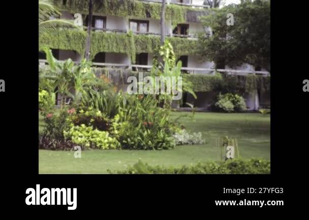 Denpasar, bali june 1985: luxuriant gardens surround a balinese hotel ...