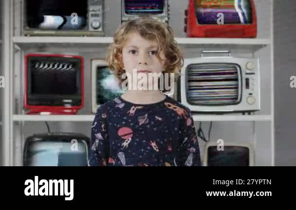young girl infront of a bank of televisions with glitch and distortion ...
