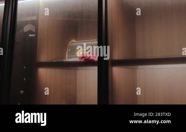 A stylish shelving unit featuring a minimalistic design that ...