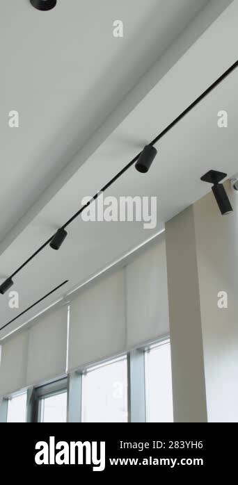 Vertical video. Sleek track lighting greatly enhances modern ...