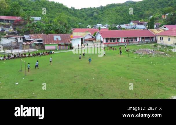 Aerial view of boys playing soccer on a rural field Stock Video Footage ...