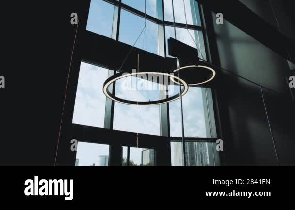 Stylish ring lights brilliantly illuminate a contemporary interior ...