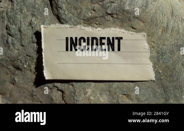 Incident report message writing on ripped torn paper piece on stone background Stock Video ...