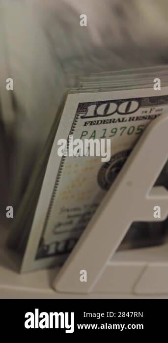 Stacks of US hundred dollar bills are displayed, highlighting the ...