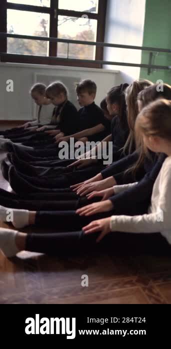 group of pre-teens perform a teacher's task during an acting class ...