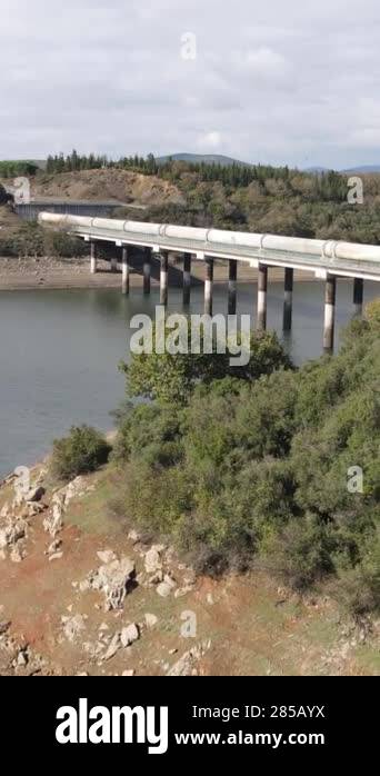 Lake barrage dam flume water aerial view, bridge over pond dam, puddle ...