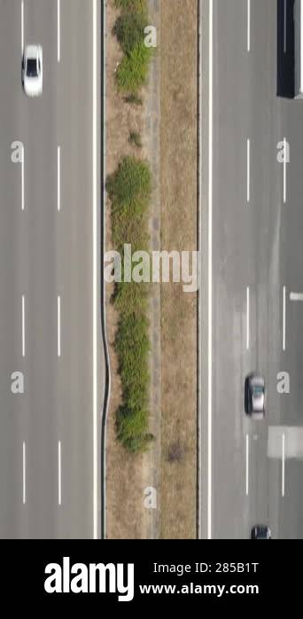 Overhead view of asphalt road with the rural area on both sides, an ...
