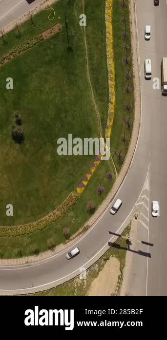 This is a view of a drone flying in city traffic, an aerial view of ...