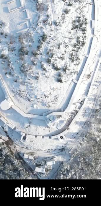 Overhead view of the castle built on the top of the snow-covered ...