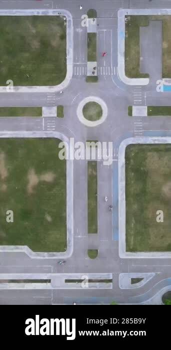 Aerial view of people having fun in the bike area big social park ...