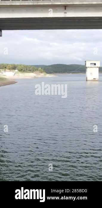 Lake barrage dam flume water aerial view, bridge over pond dam, puddle ...