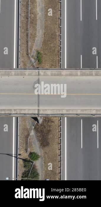 Aerial view of asphalt road with the rural area on both sides, the ...