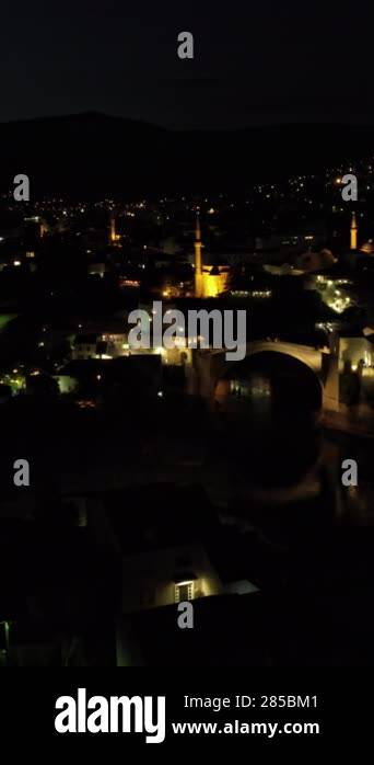 Night illuminated drone view of the historical Mostar building and ...