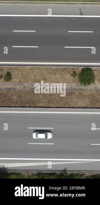 Overhead view of asphalt road with the rural area on both sides, the ...