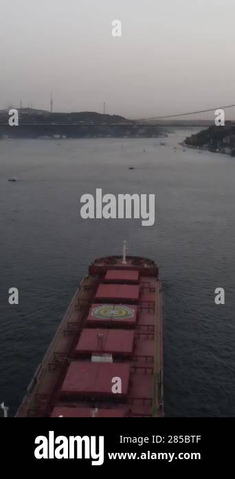 Overhead view of a cargo ship passing through the strait of the big ...