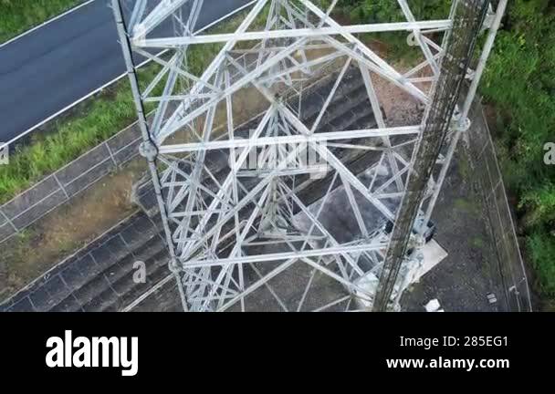 A tall communication tower equipped with multiple antennas, standing ...