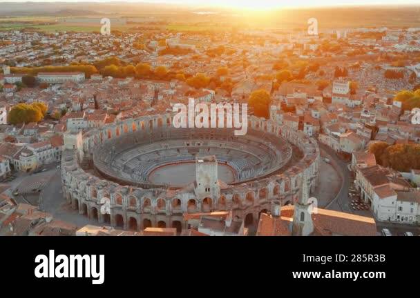 Cityscape of Arles at sunrise, southern France. HIstoric buildings ...