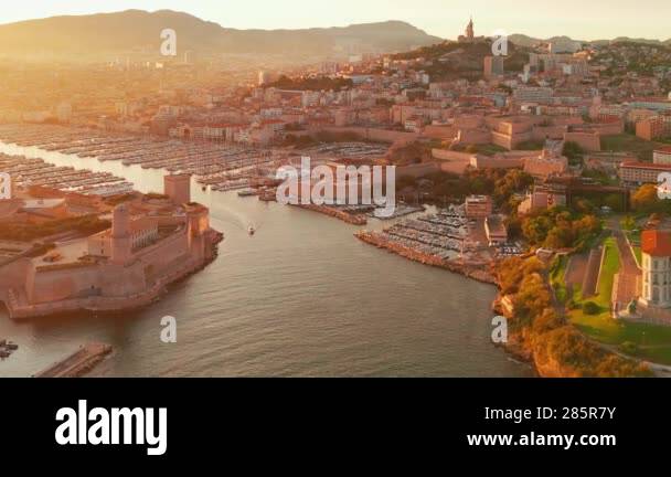 Aerial view of the historic Vieux Port in Marseille at sunrise ...